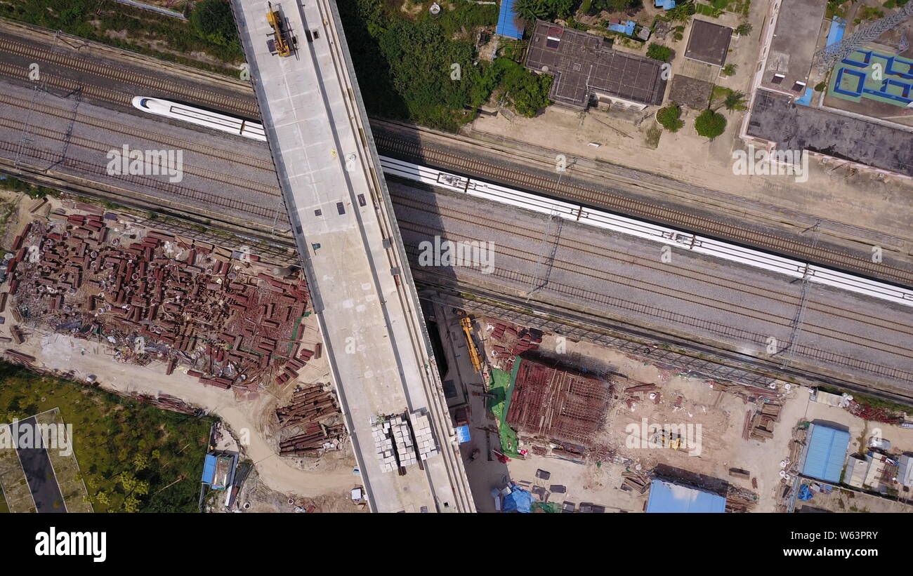 An 18,000-tonne box girder bridge is rotating 120 degrees over a ...