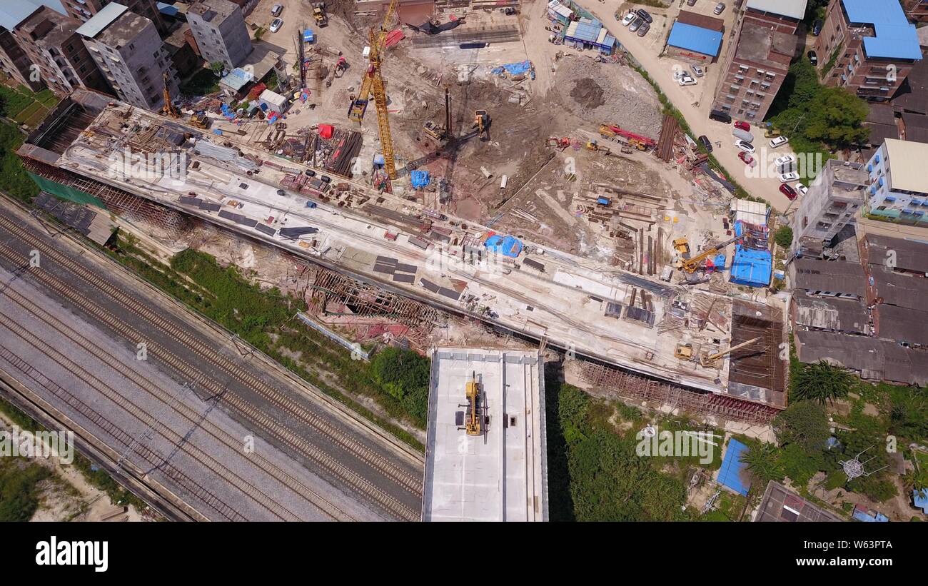 An 18,000-tonne box girder bridge is rotating 120 degrees over a ...