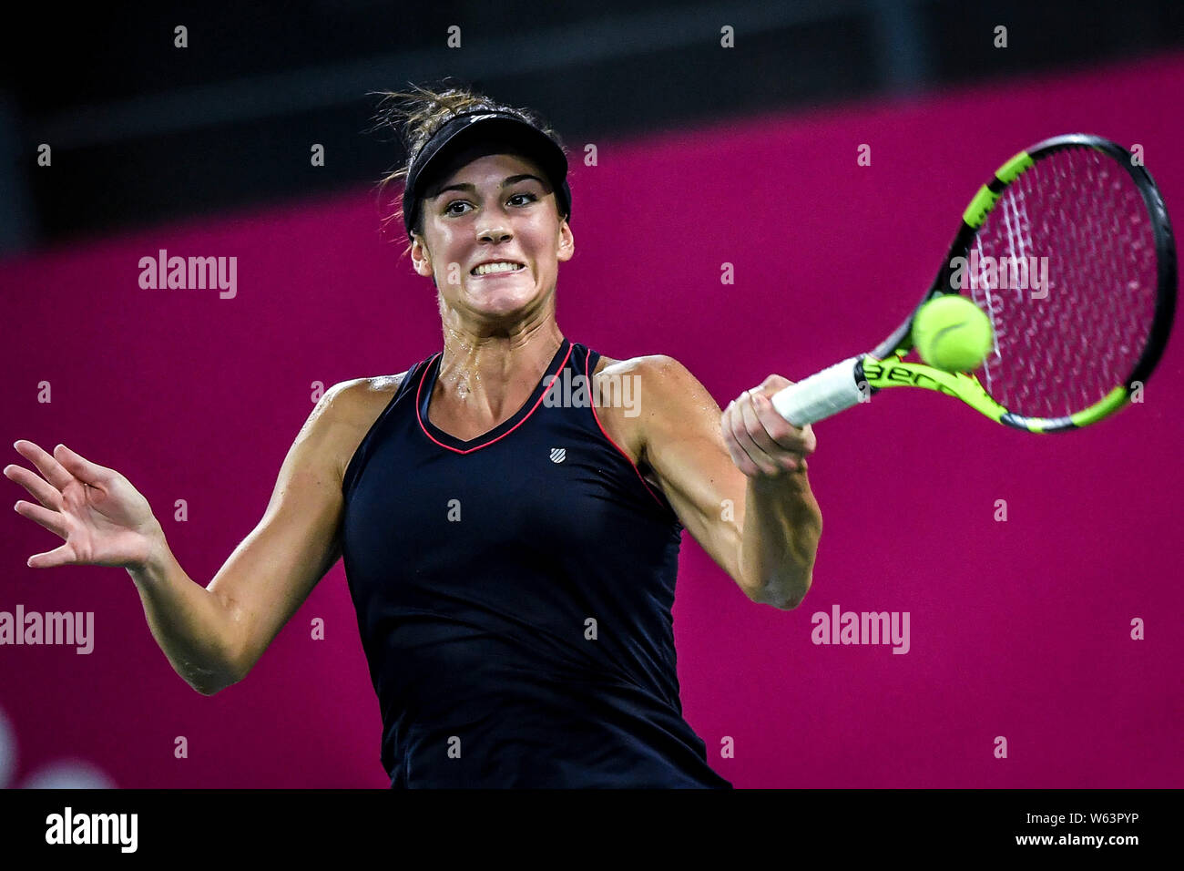 Bernarda Pera of the USA returns a shot to Aleksandra Krunic of Serbia ...