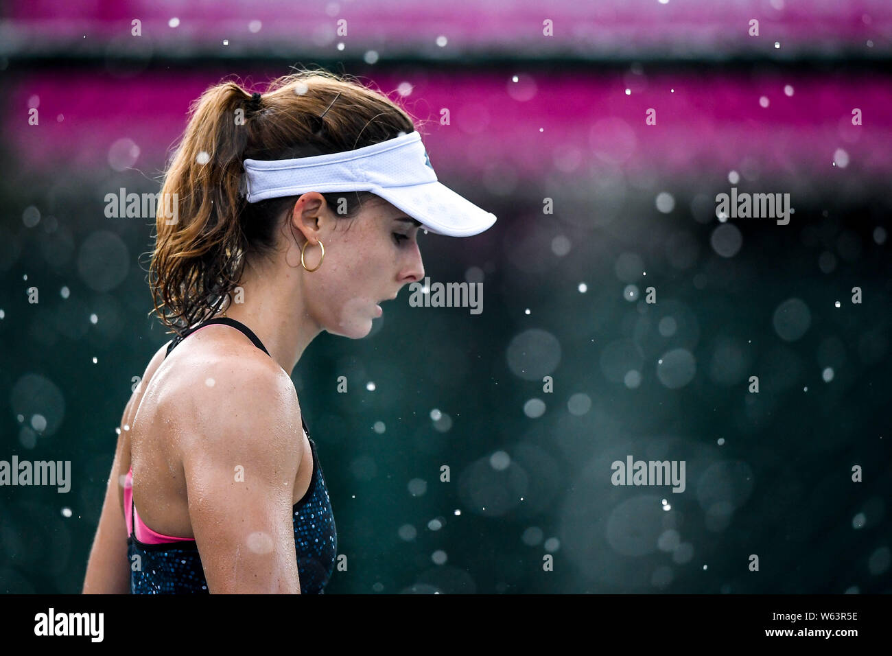 Alize Cornet of France competes against Jennifer Brady of the United ...