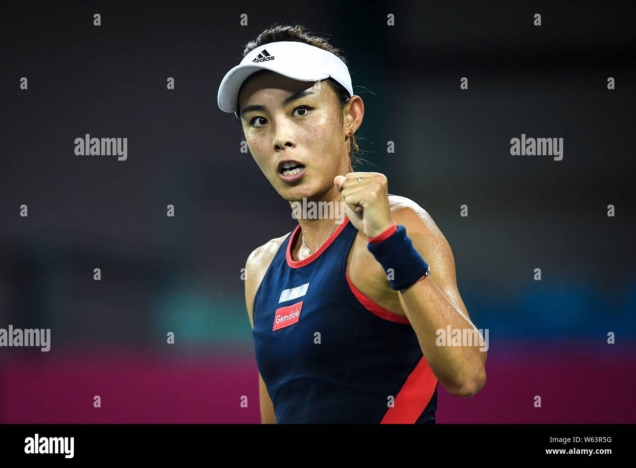 Wang Qiang of China reacts after scoring against Andrea Petkovic of Germany in their semifinal ...