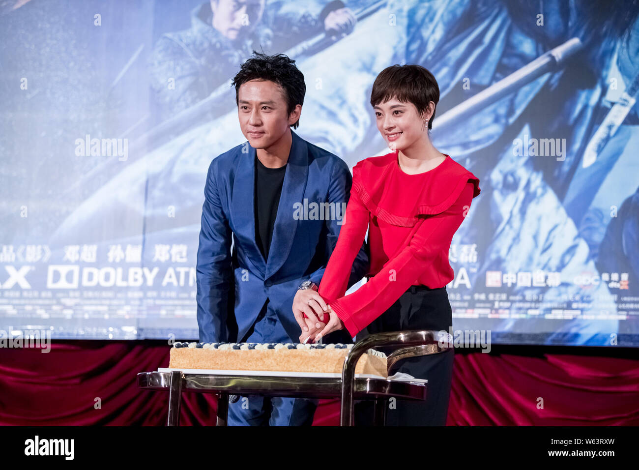 Chinese actress Sun Li, right, and her husband actor Deng Chao attend a premiere event for their ...