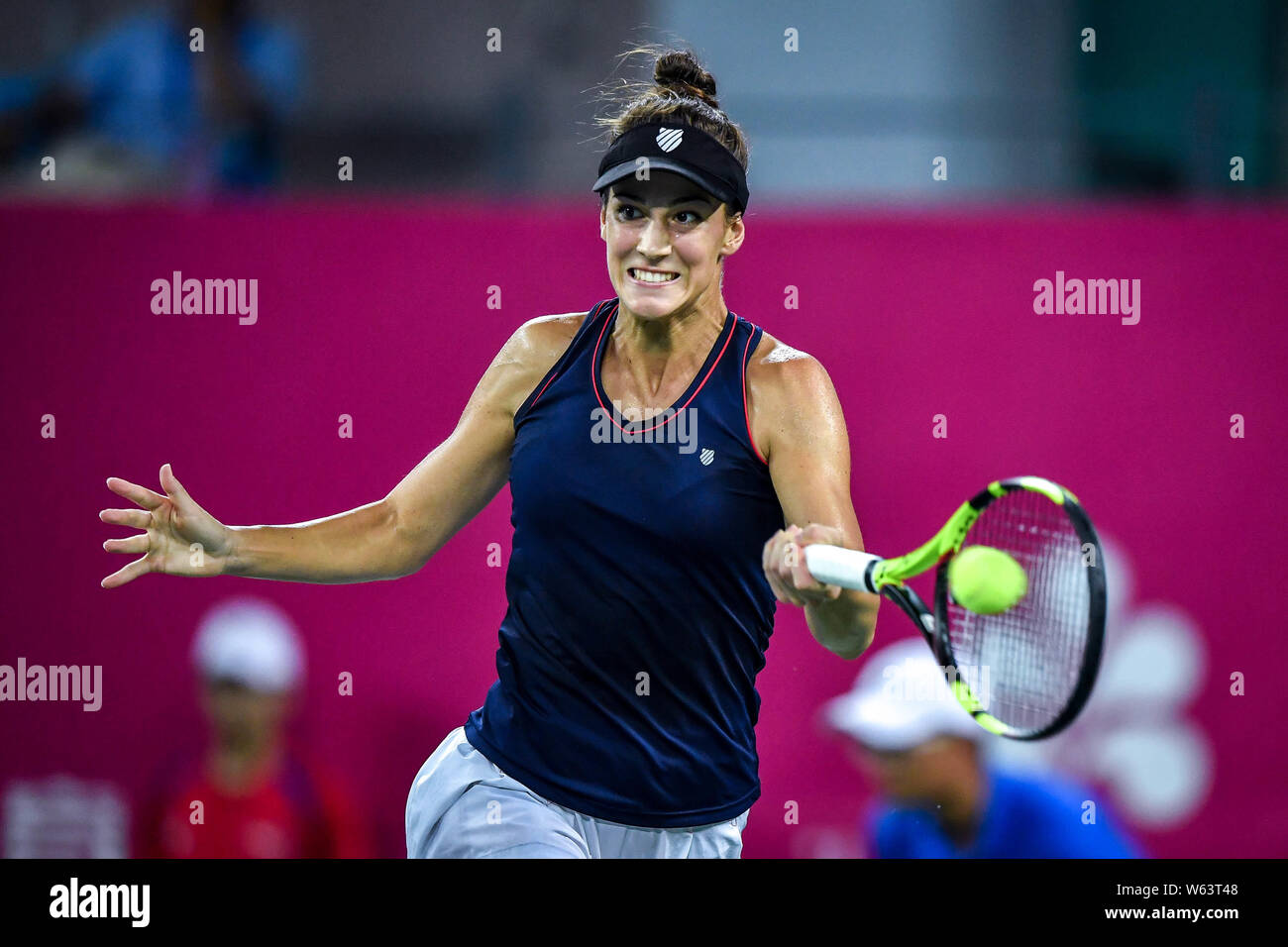 Bernarda Pera of the USA returns a shot to Aleksandra Krunic of Serbia ...