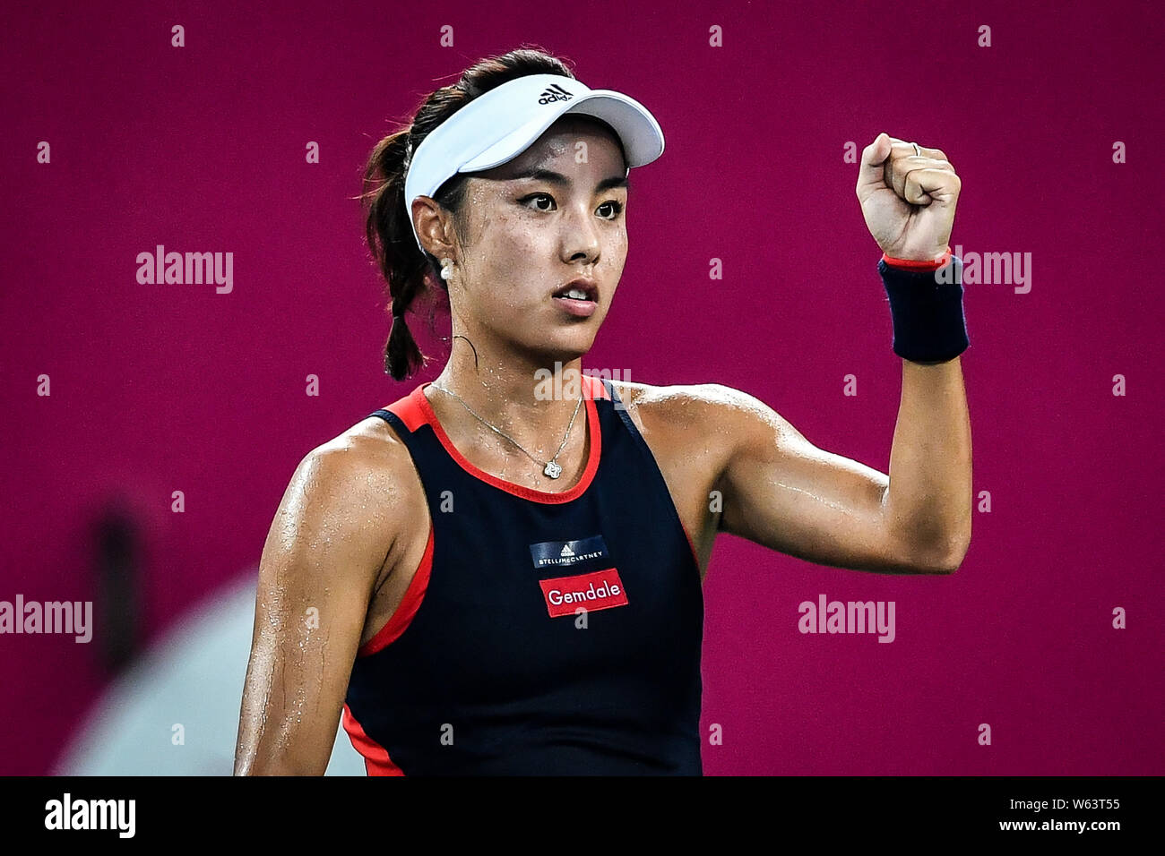 Wang Qiang of China reacts after scoring against Andrea Petkovic of ...