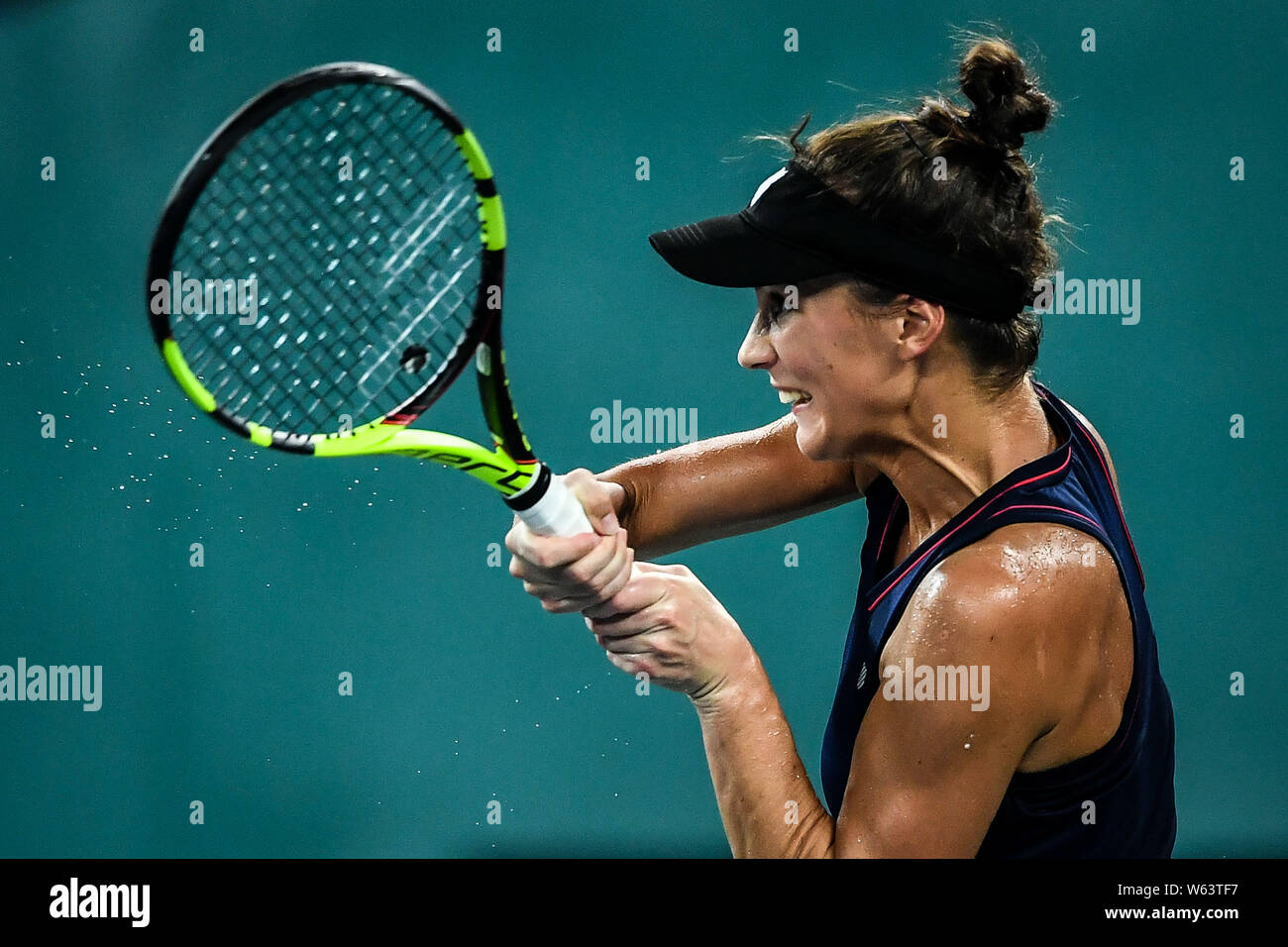 Bernarda Pera of the USA returns a shot to Aleksandra Krunic of Serbia ...