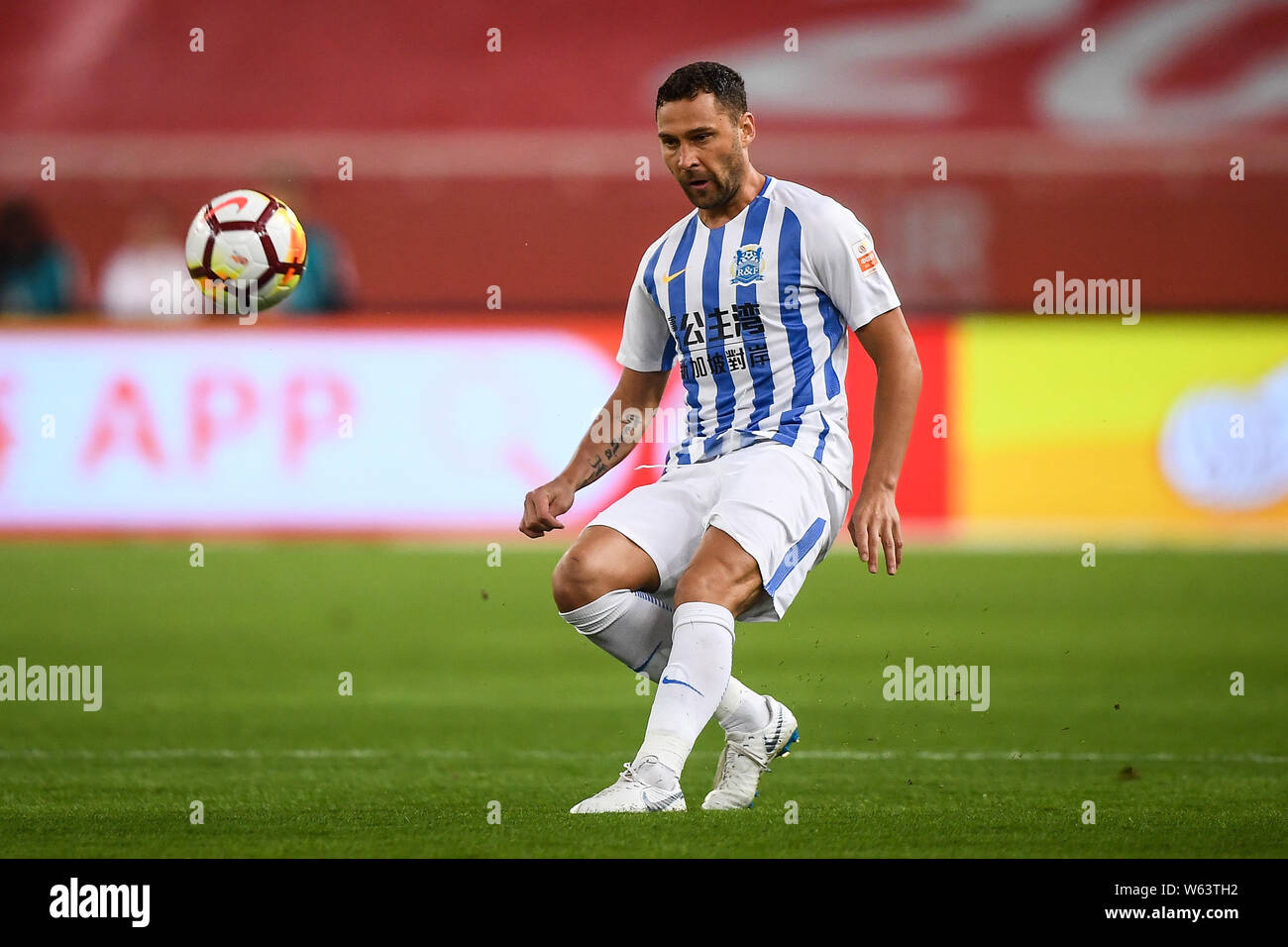 Serbian football player Dusko Tosic of Guangzhou R&F competes against ...