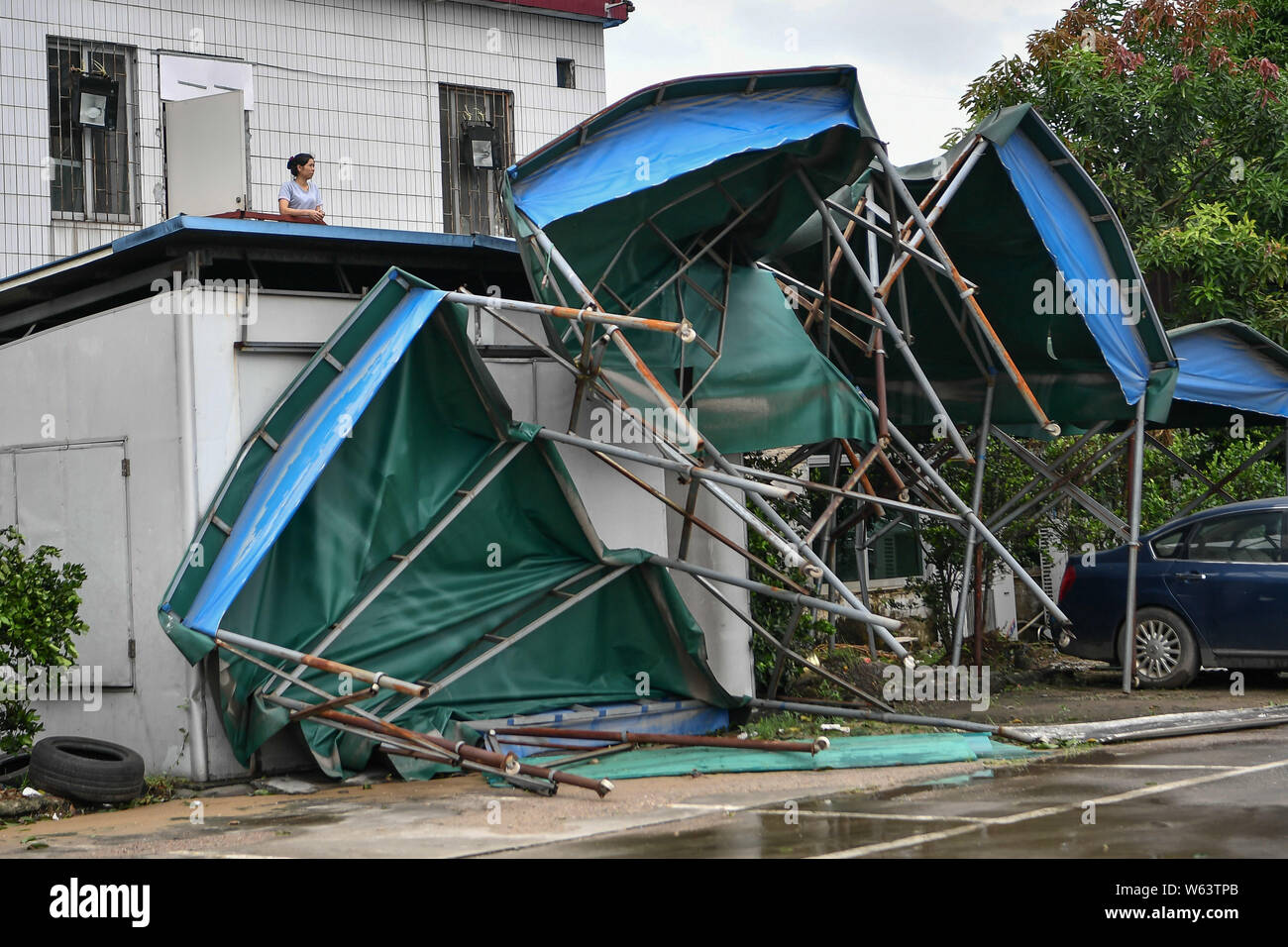 The rooftop of buildings are damaged by strong wind caused by Typhoon ...