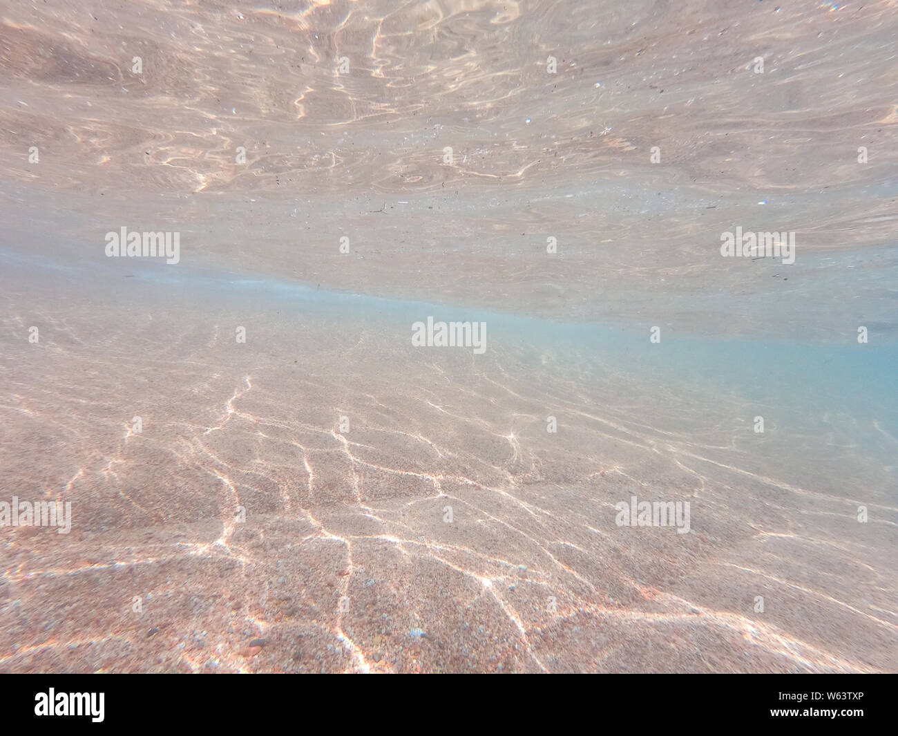 underwater background with sandy sea bottom. Beautiful texture of the ...
