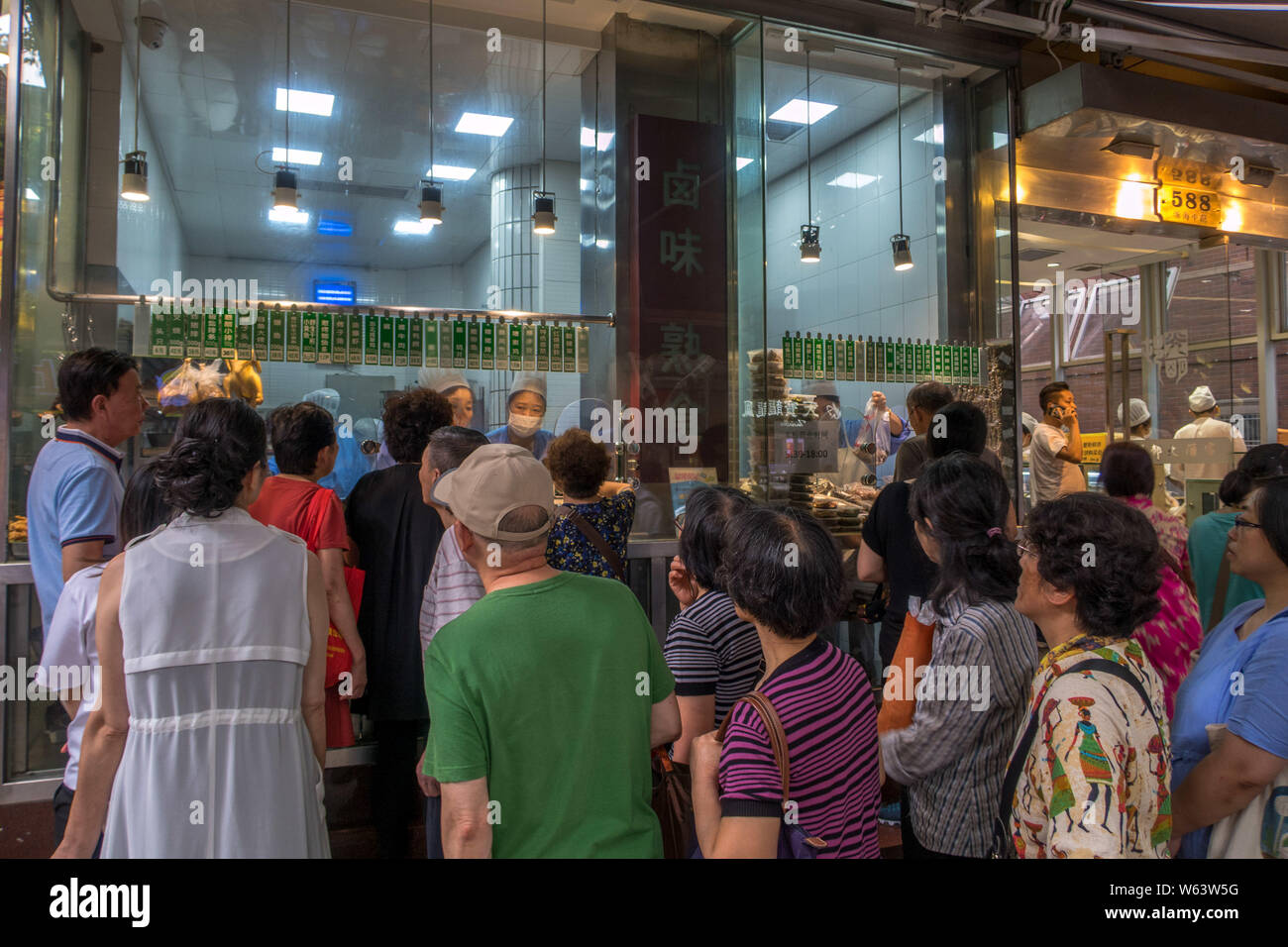 Chinese customers queue up to buy mooncakes to celebrate the upcoming ...