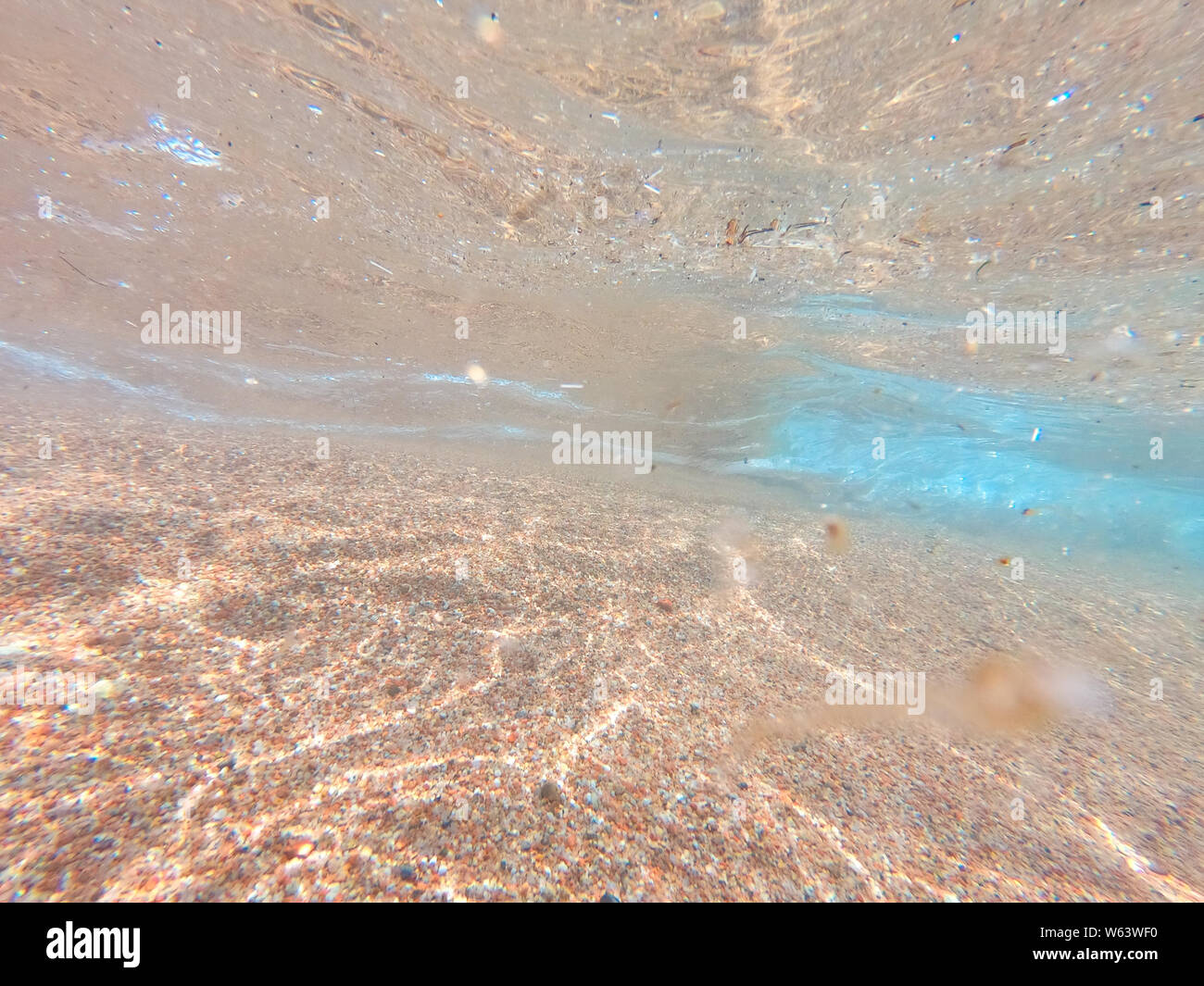 underwater background with sandy sea bottom. Beautiful texture of the ...