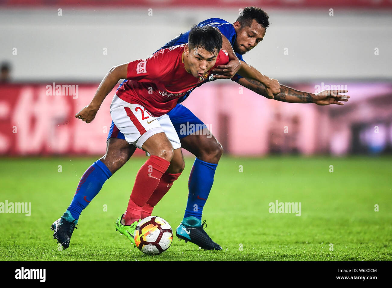 Colombian football player Fredy Guarin, behind, of Shanghai Greenland ...