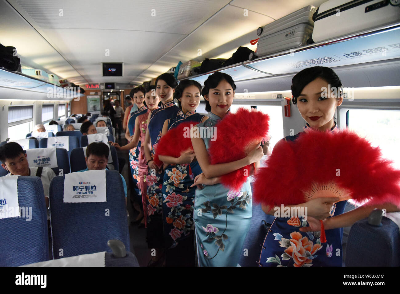 A dozen of artists in colorful cheongsam, also known as qipao in ...