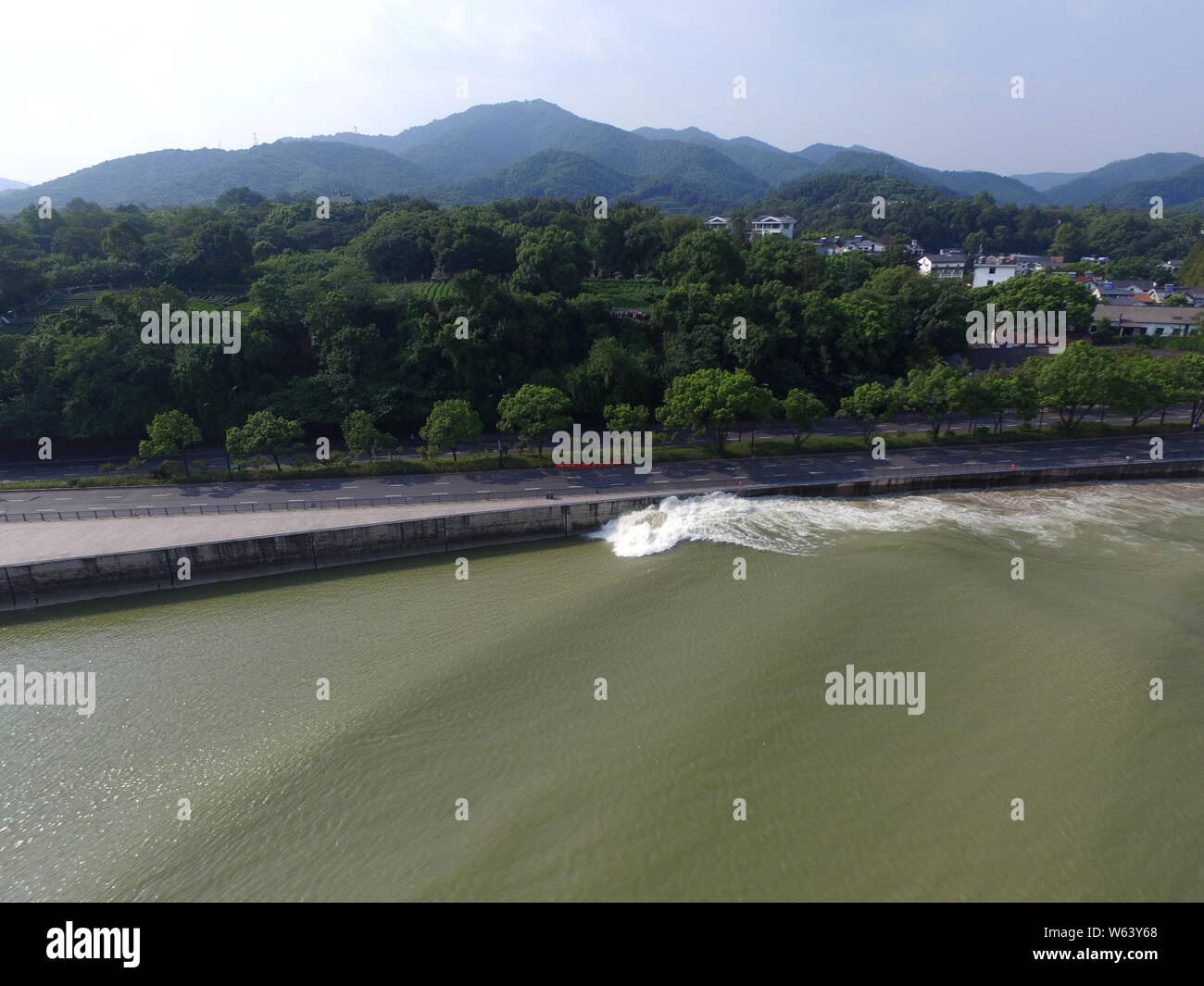 Aerial view of tidal bores from the Qiantang River surging the ...