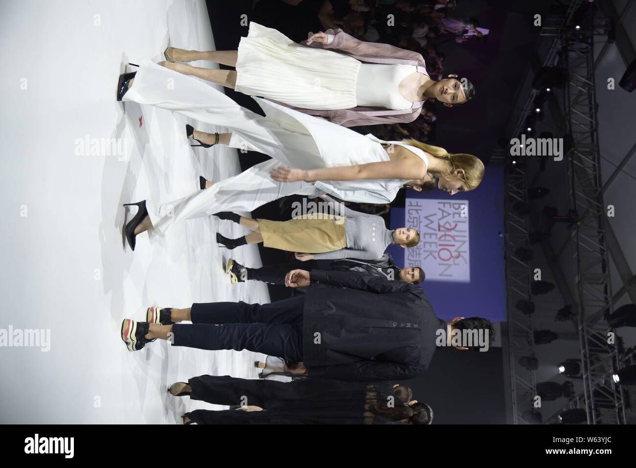 Models display new creations at the SHAO fashion show during the 2018 ...