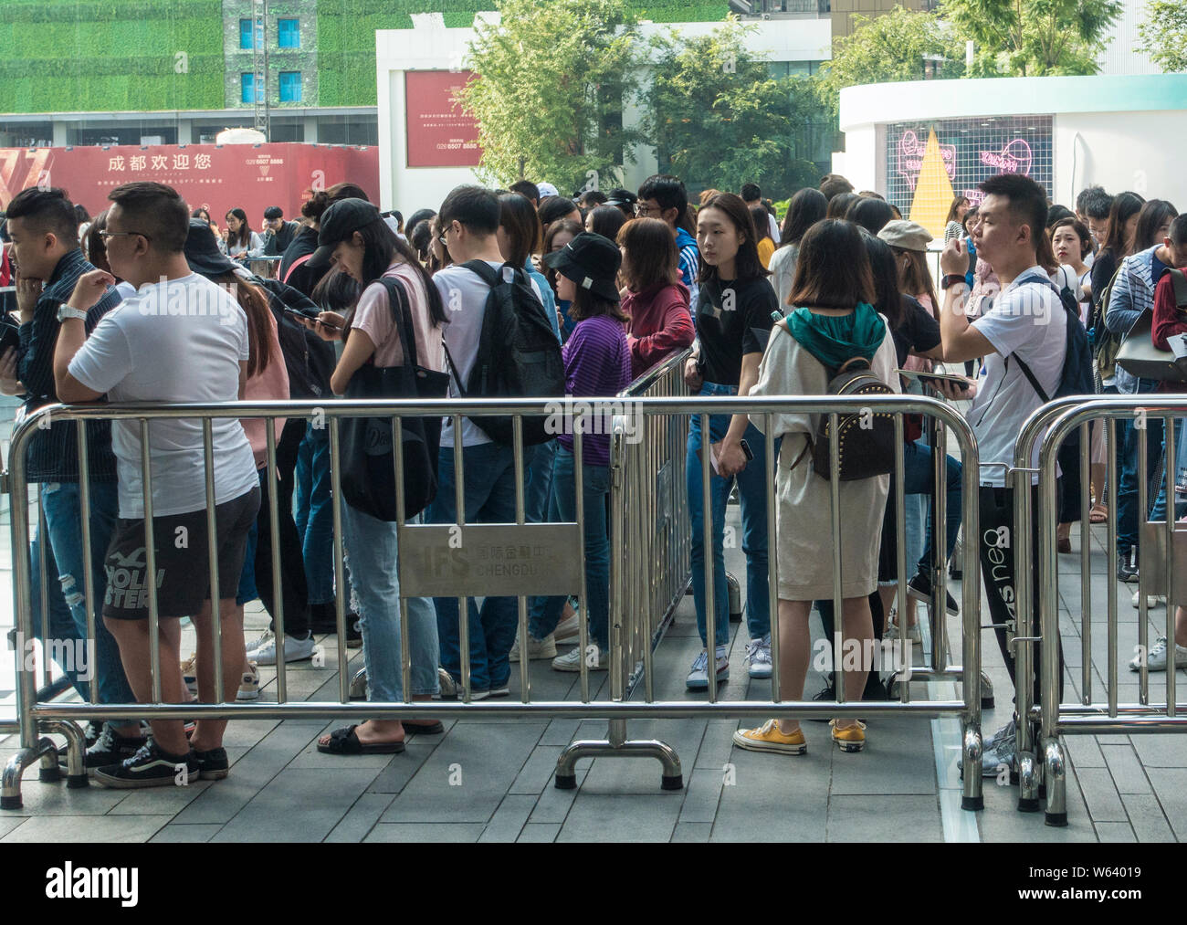 Chinese customers queue up to buy cheese tea at a branch of HEYTEA, a ...