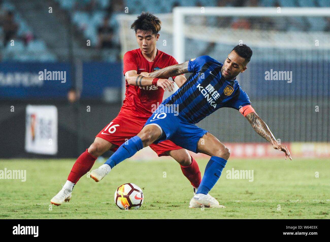 Brazilian football player Alex Teixeira of Jiangsu Suning, right ...