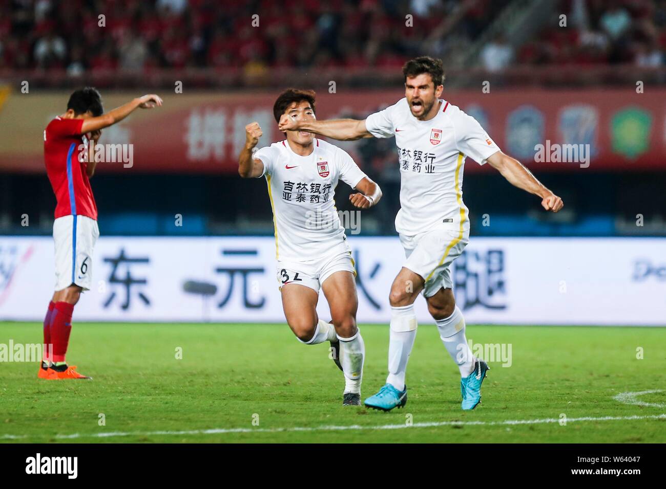 Serbian football player Nemanja Pejcinovic, right, of Changchun Yatai ...