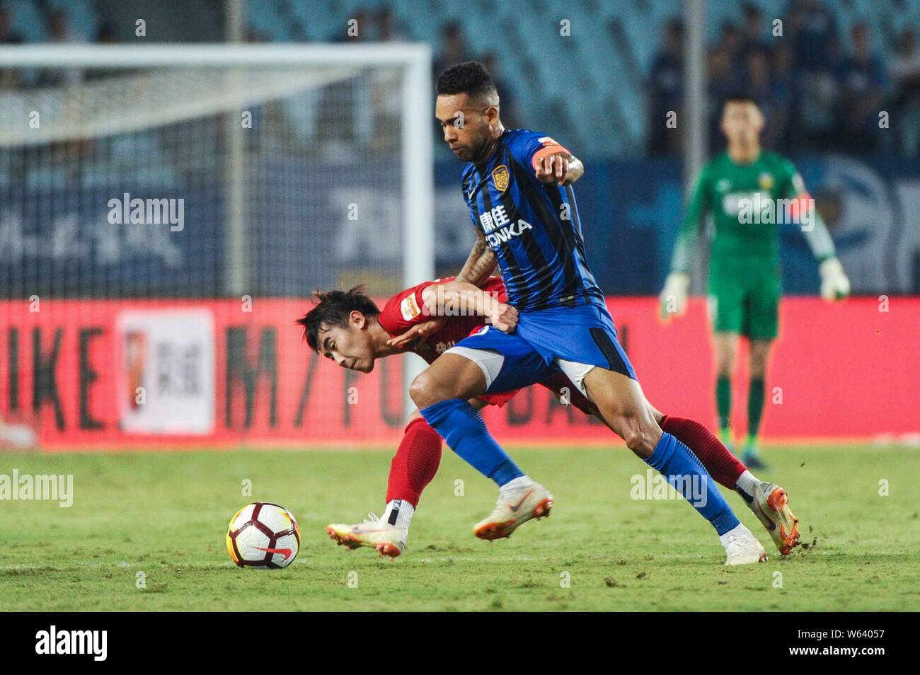 Brazilian football player Alex Teixeira of Jiangsu Suning, right ...