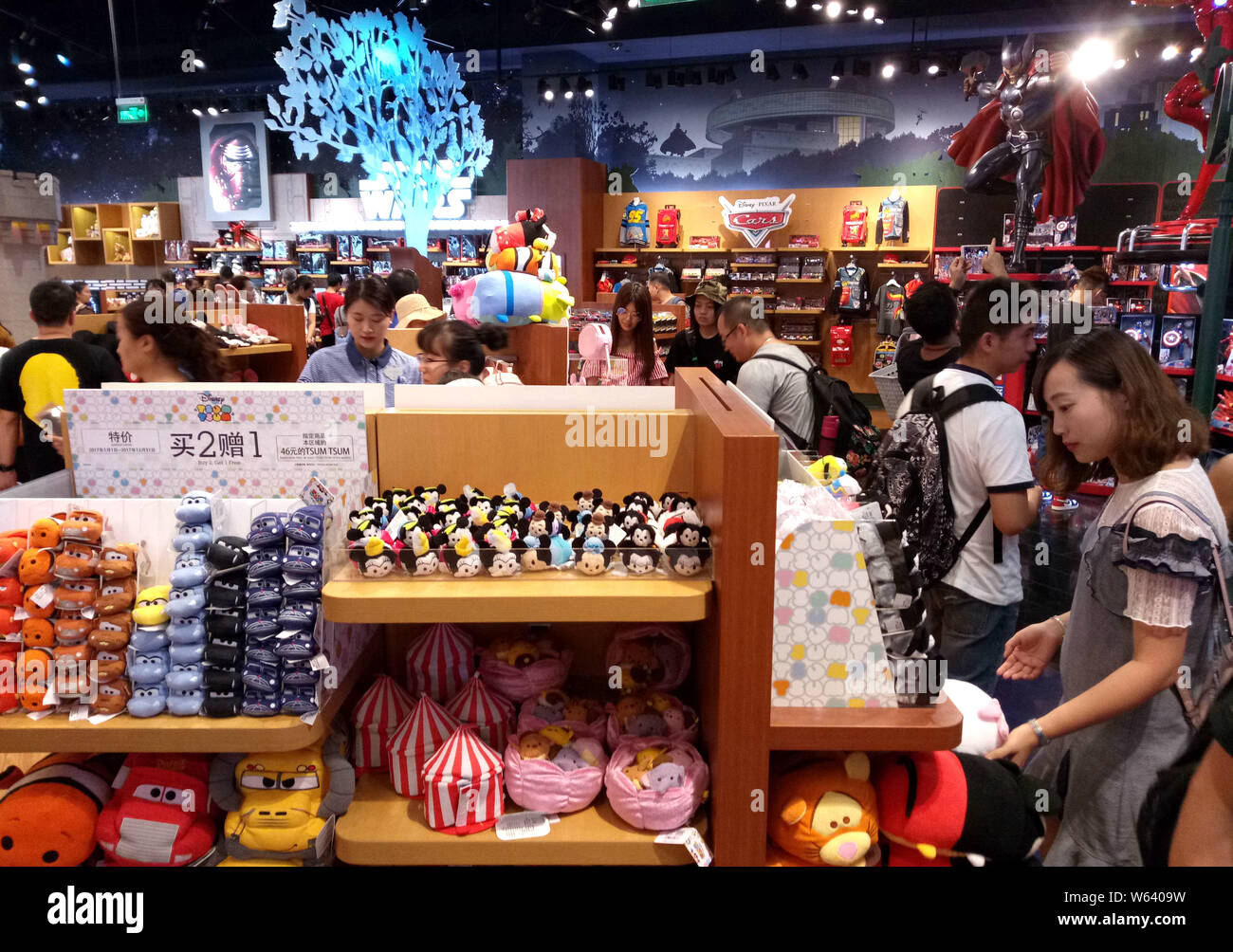 --FILE--Customers shop for toys, souvenirs and other Disney-licensed ...