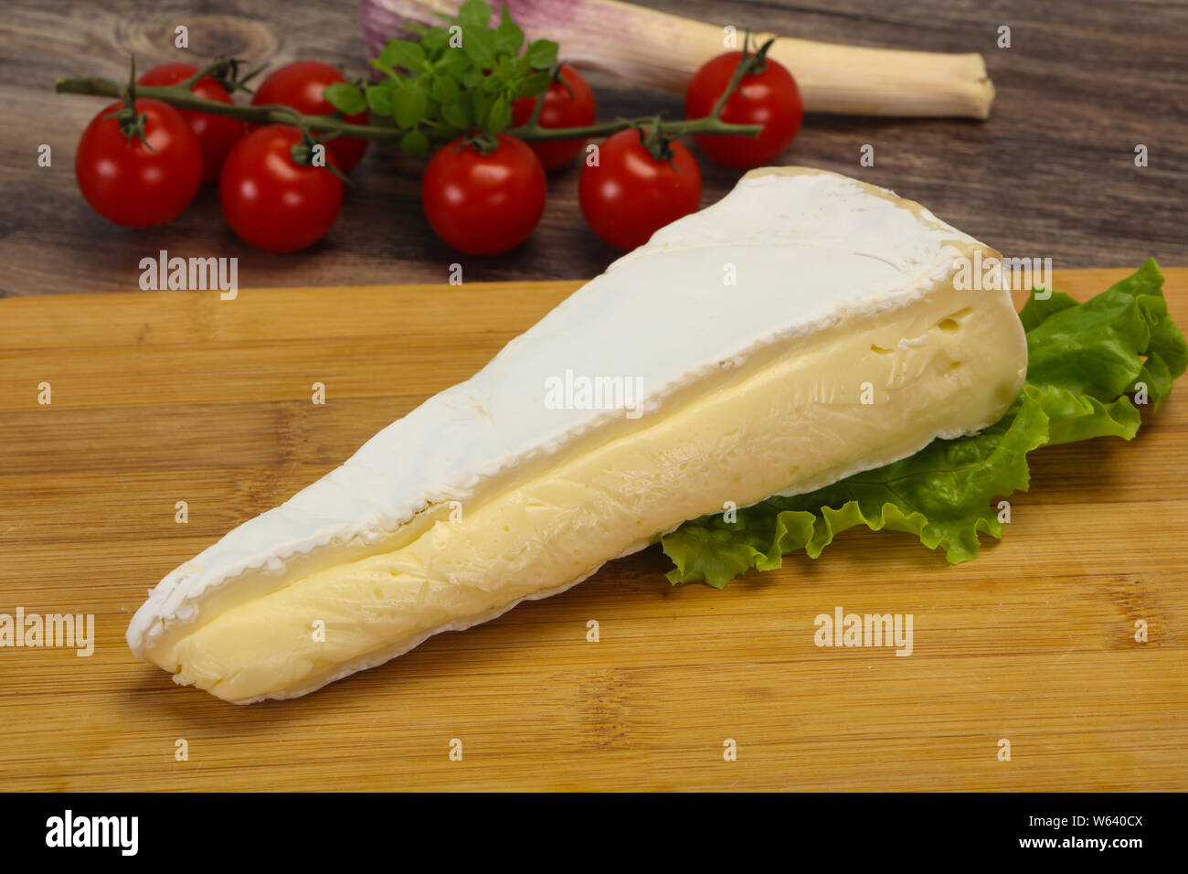 Brie cheese triangle served salad leaves Stock Photo - Alamy