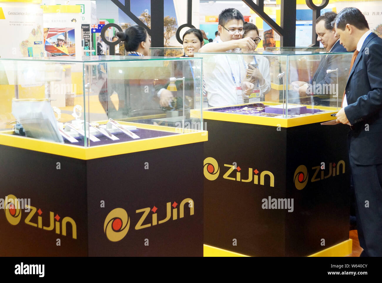 --FILE--People visit the stand of Zijin Mining Group Co. Ltd. during an ... --FILE--People visit the stand of Zijin Mining Group Co. Ltd. during an ...