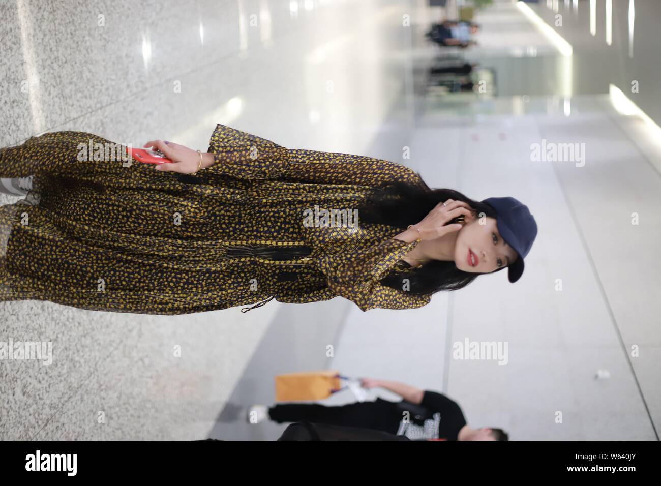 Chinese actress Yao Chen arrives at the Shanghai Hongqiao International Airport before departure ...