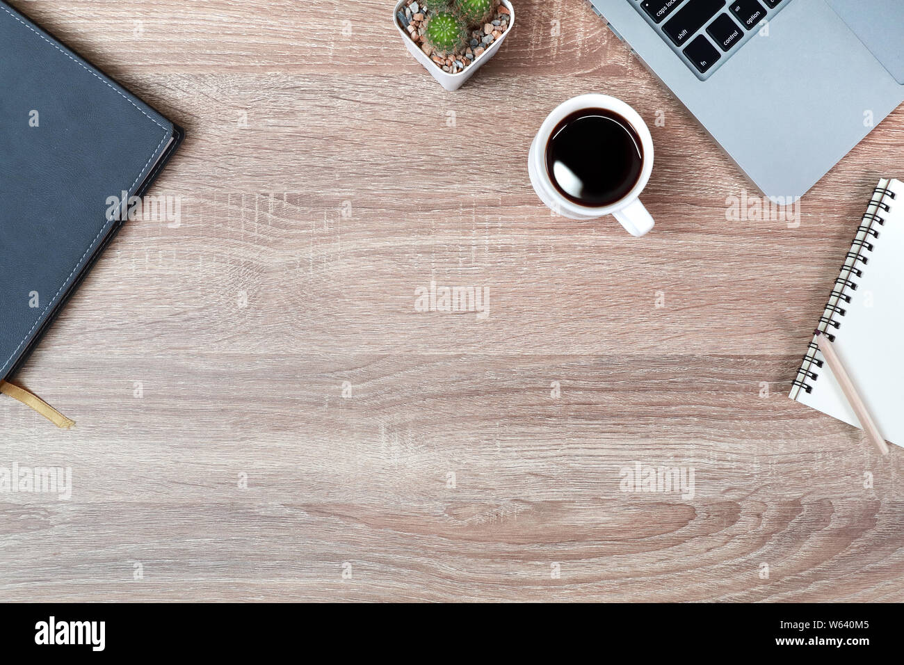technology working wood table with laptop computer, coffee cup and ...