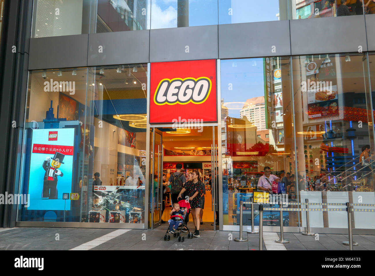 Customers leave the second Lego Flagship Store at Shanghai ShiMao ...