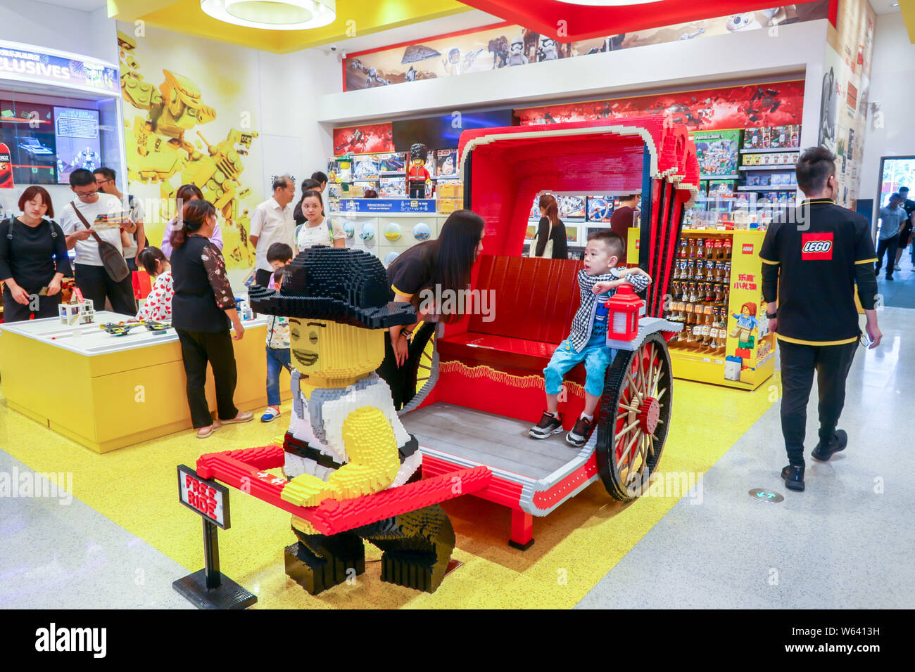 Customers visit the second Lego Flagship Store at Shanghai ShiMao ...
