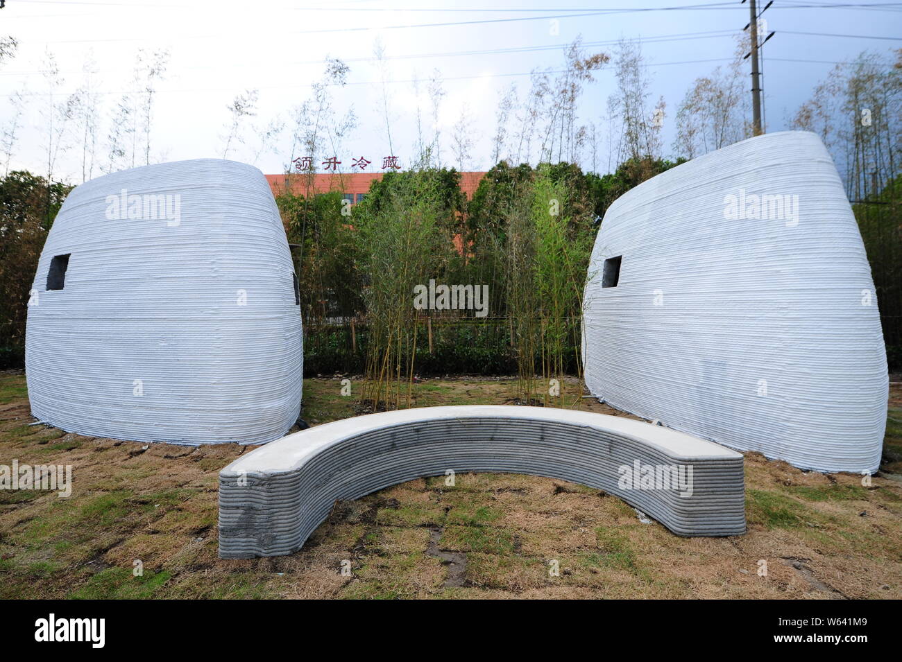 3D-printed houses are on display during the 3D Printing Industry Expo ...