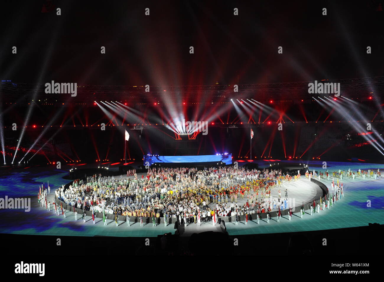 Athletes from different countries attend the closing ceremony of the ...