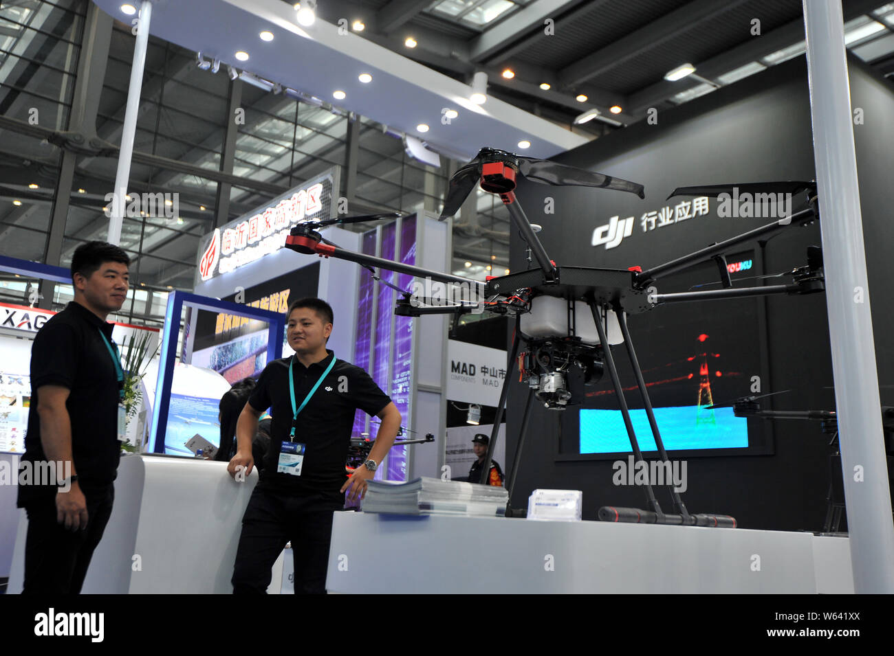 --FILE--Employees are pictured at the stand of Chinese drone maker DJI ...