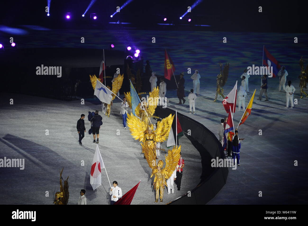 Athletes from different countries attend the closing ceremony of the ...