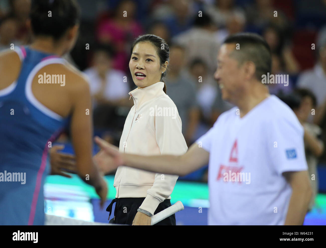 Retired Chinese tennis star Li Na is pictured at a first round match ...