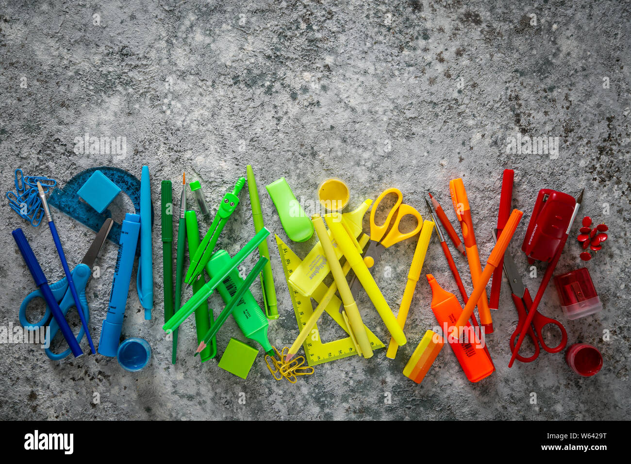 Selection of colorful stationery on rustic background Stock Photo - Alamy