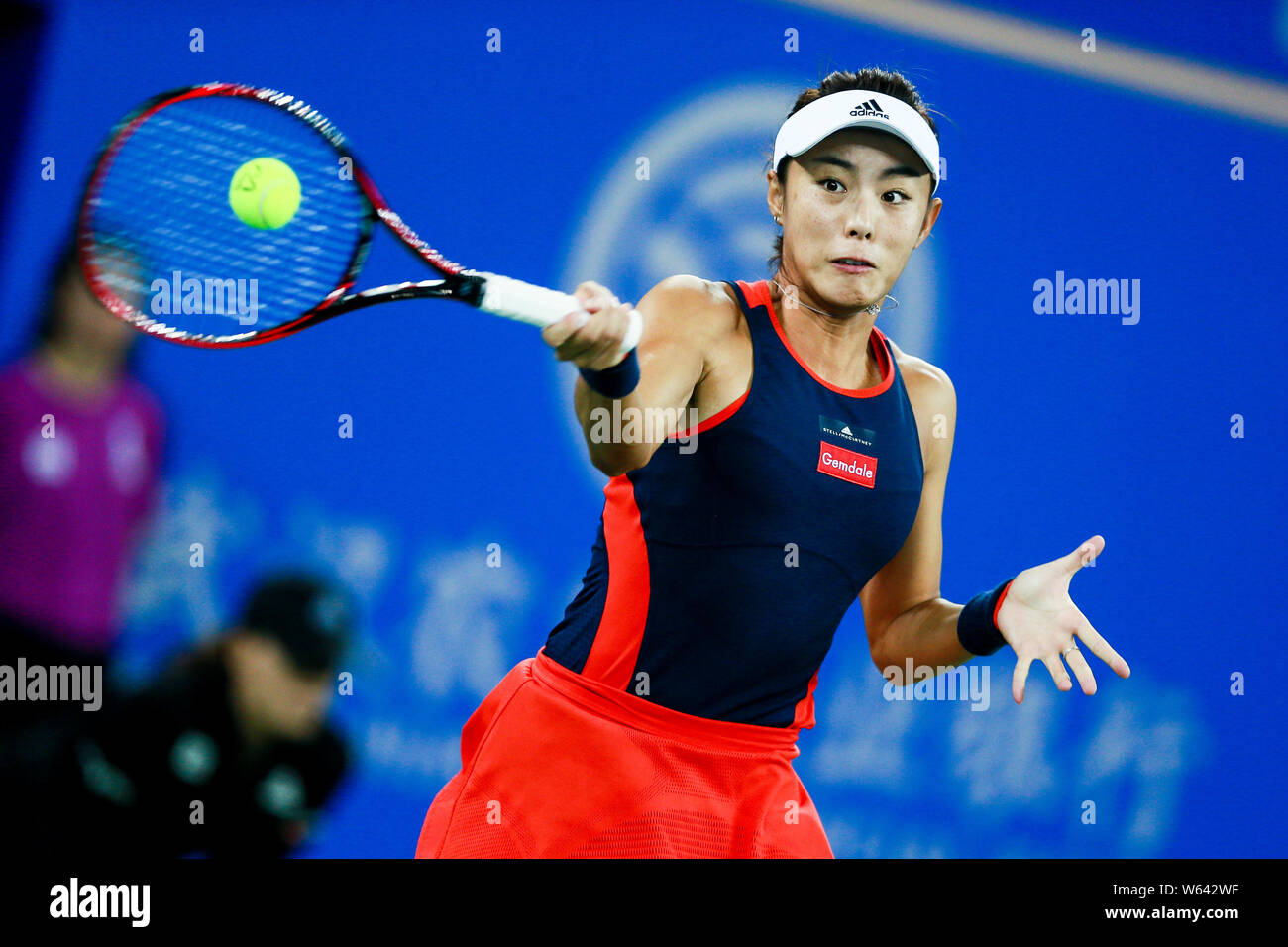 Wang Qiang of China returns a shot to Daria Gavrilova of Australia in ...