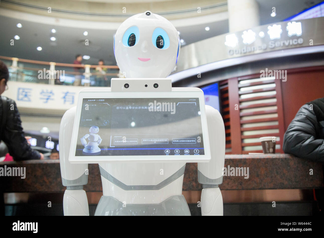 A robot receptionist named Xiaoman serves patients in the outpatient ...