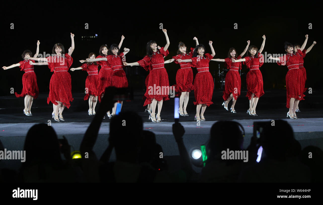 Members of Japanese idol group Nogizaka46 perform during a concert in ...