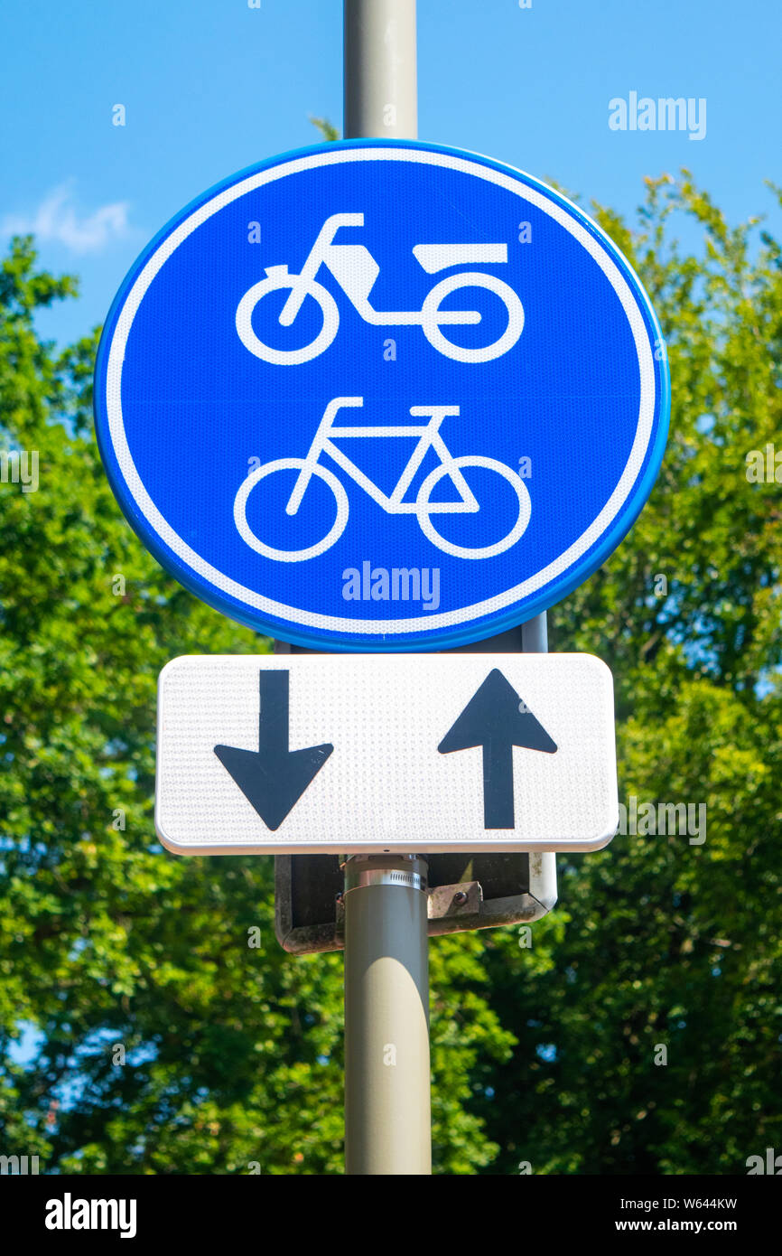Dutch traffic sign: cyclists and moped riders can ride a moped path ...