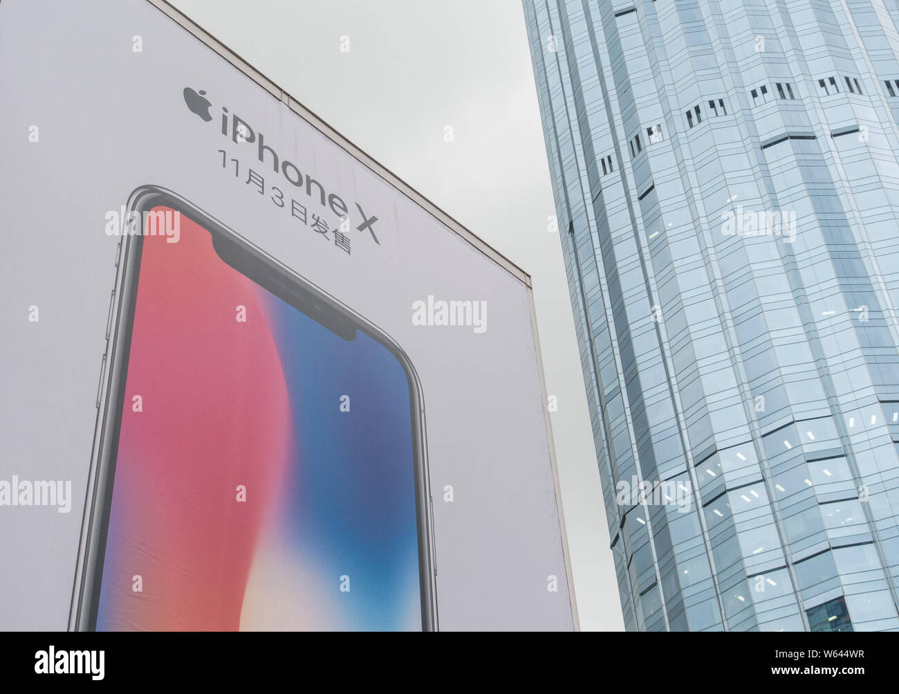 --FILE--An advertisement for iPhone X smartphone is on display at the ...
