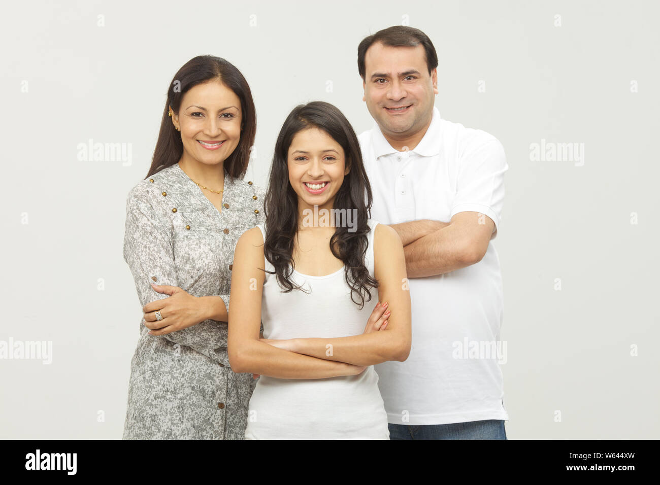 Family standing together smiling Stock Photo - Alamy