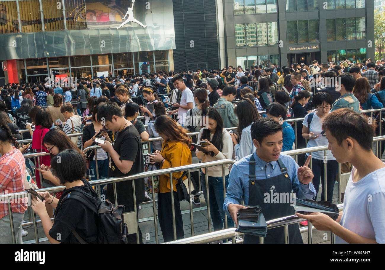 Chinese customers queue up to buy cheese tea at a branch of HEYTEA, a ...