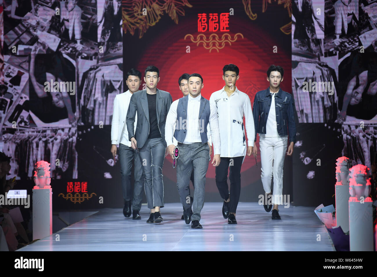 Models display new creations at the XIFUHUI fashion show during the ...