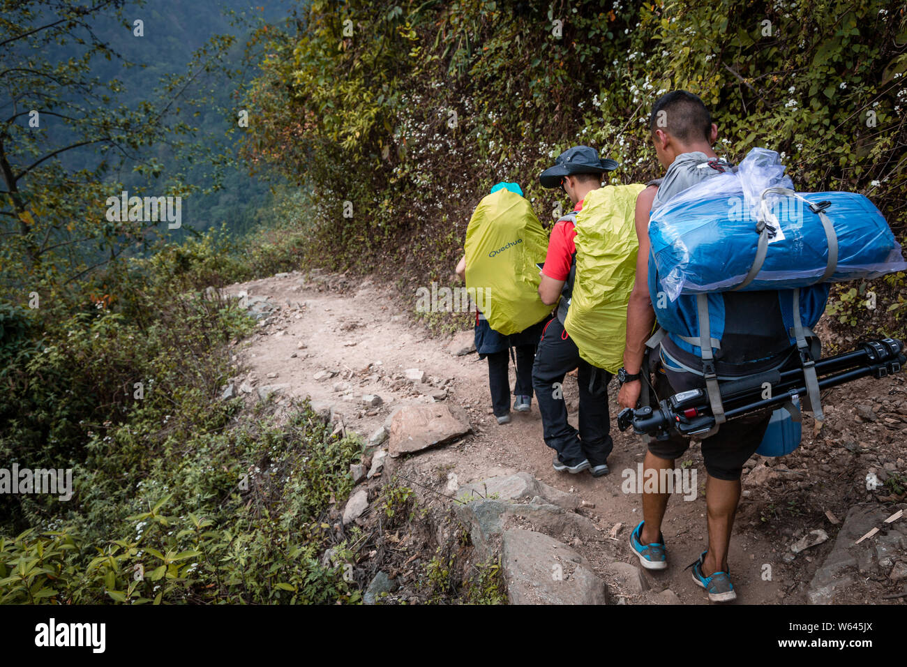 Three trekkers on the Gochela trekking trail to the Kanchenjunga ...