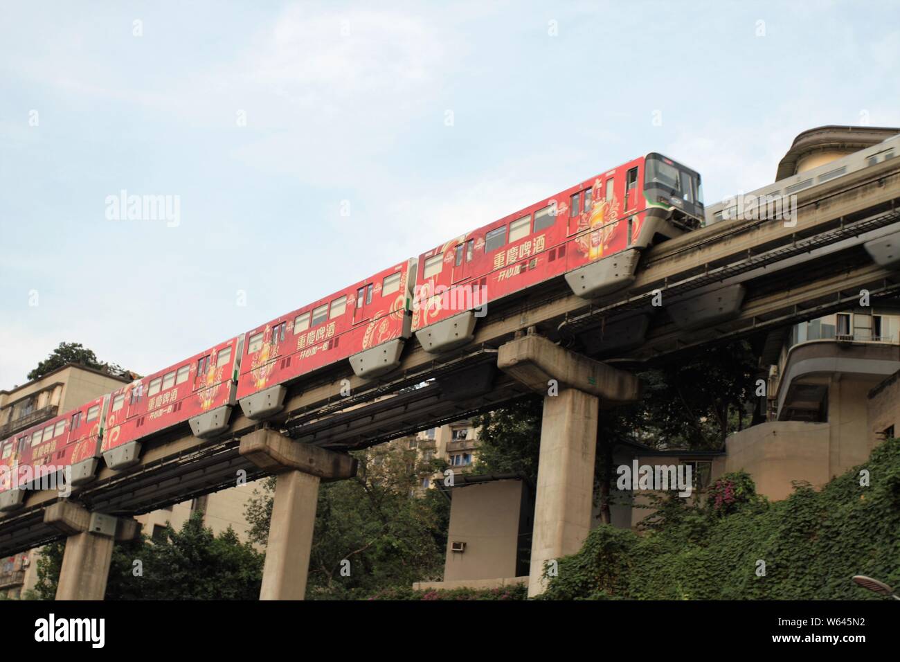 A monorail train of Chongqing Light Rail Line 2 prepares to run through ...