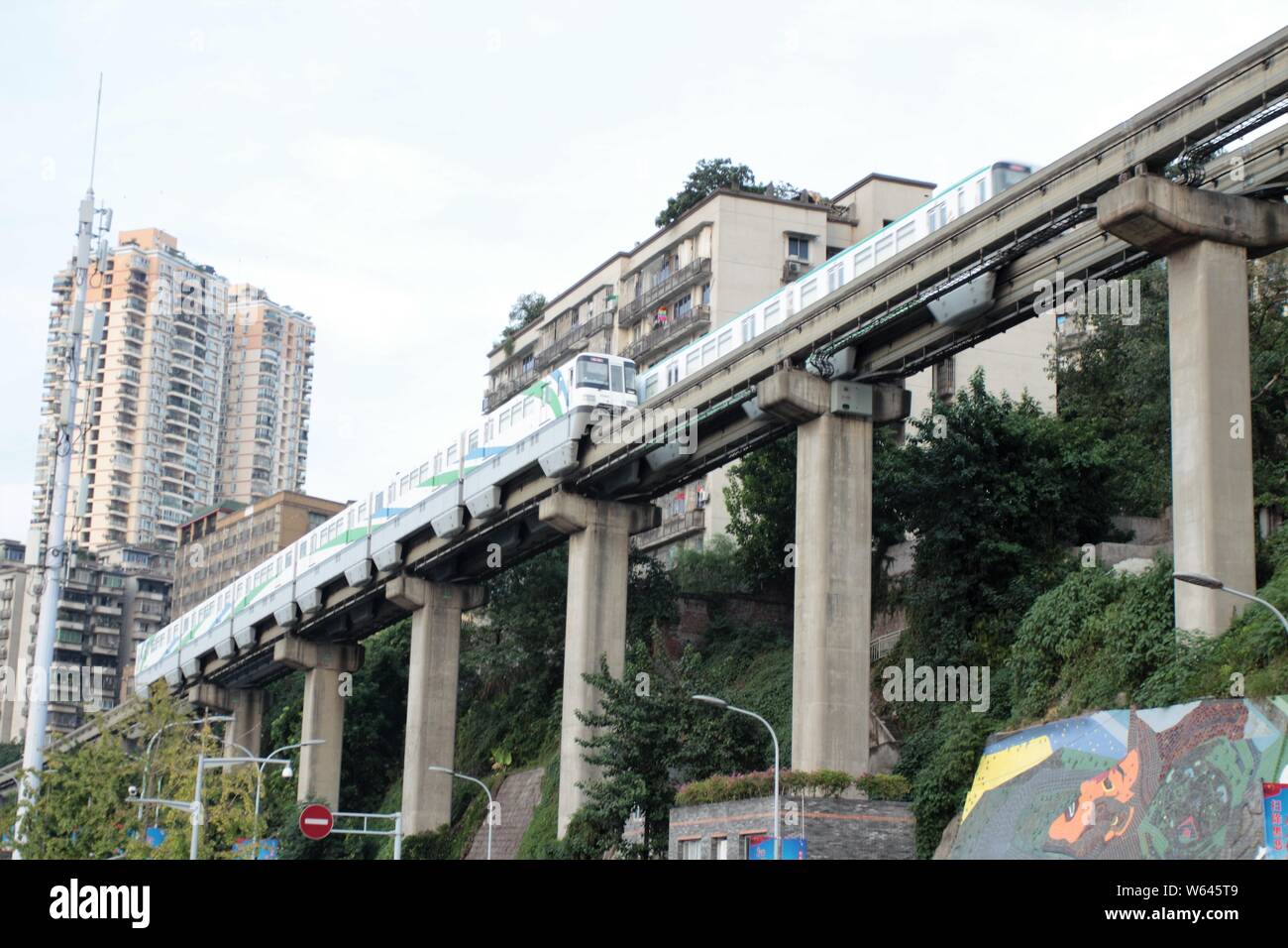 A monorail train of Chongqing Light Rail Line 2 prepares to run through ...