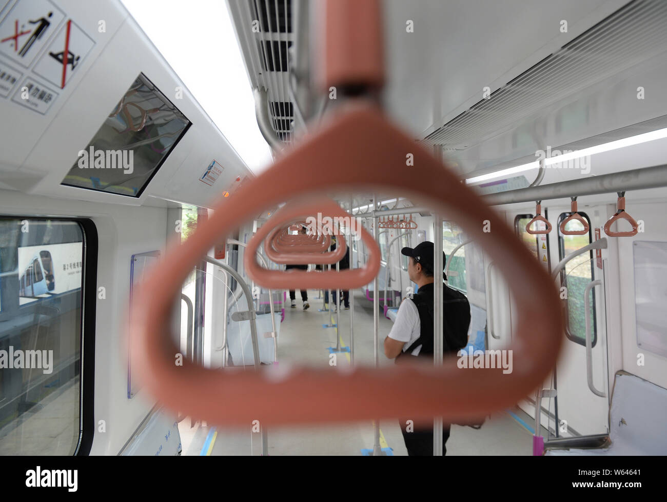 A Chengdu Subway line 5 train using facial makeup in Sichuan opera as ...
