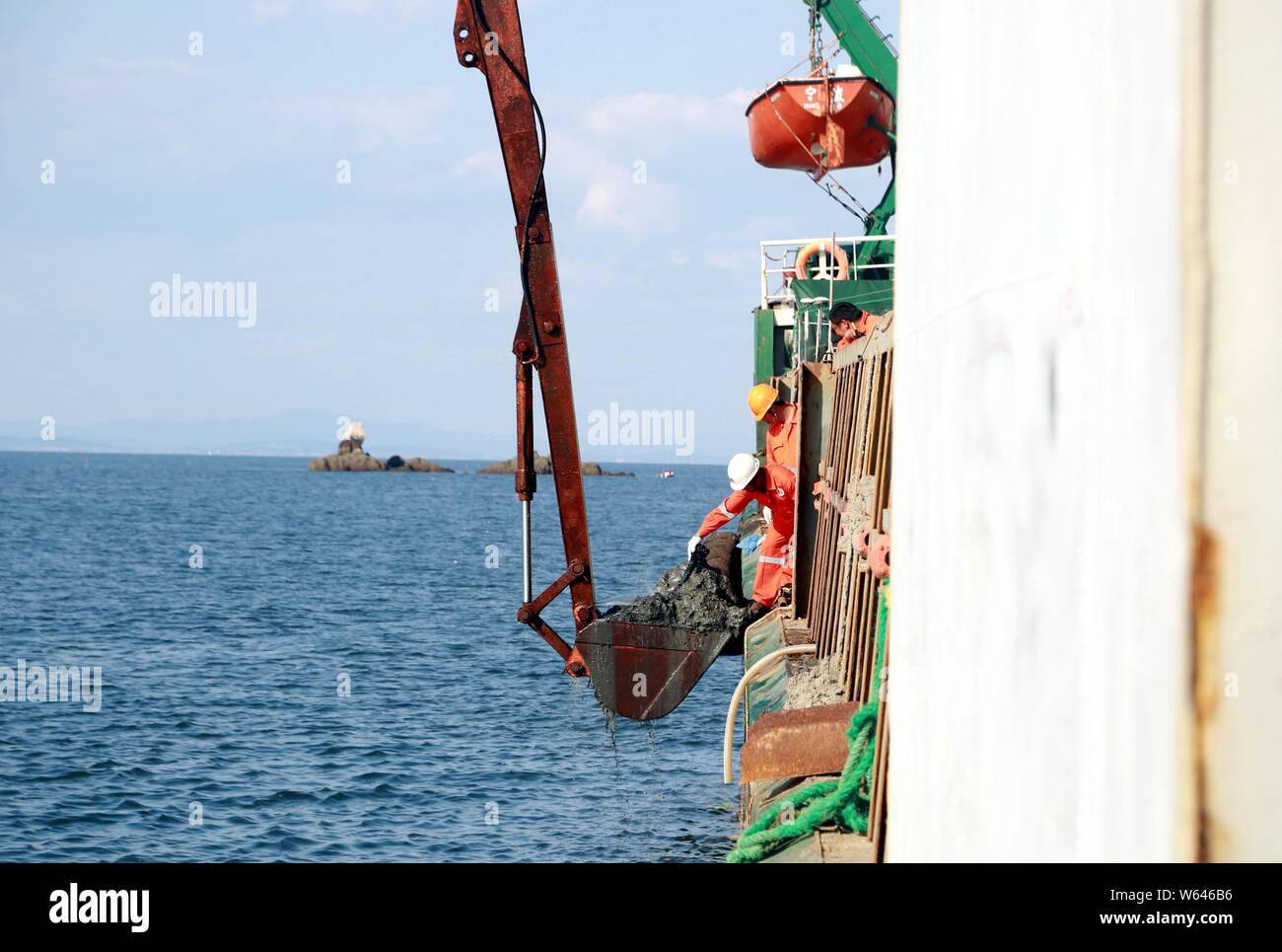 Chinese workers unearth weaponry equipment as well as some tools from ...