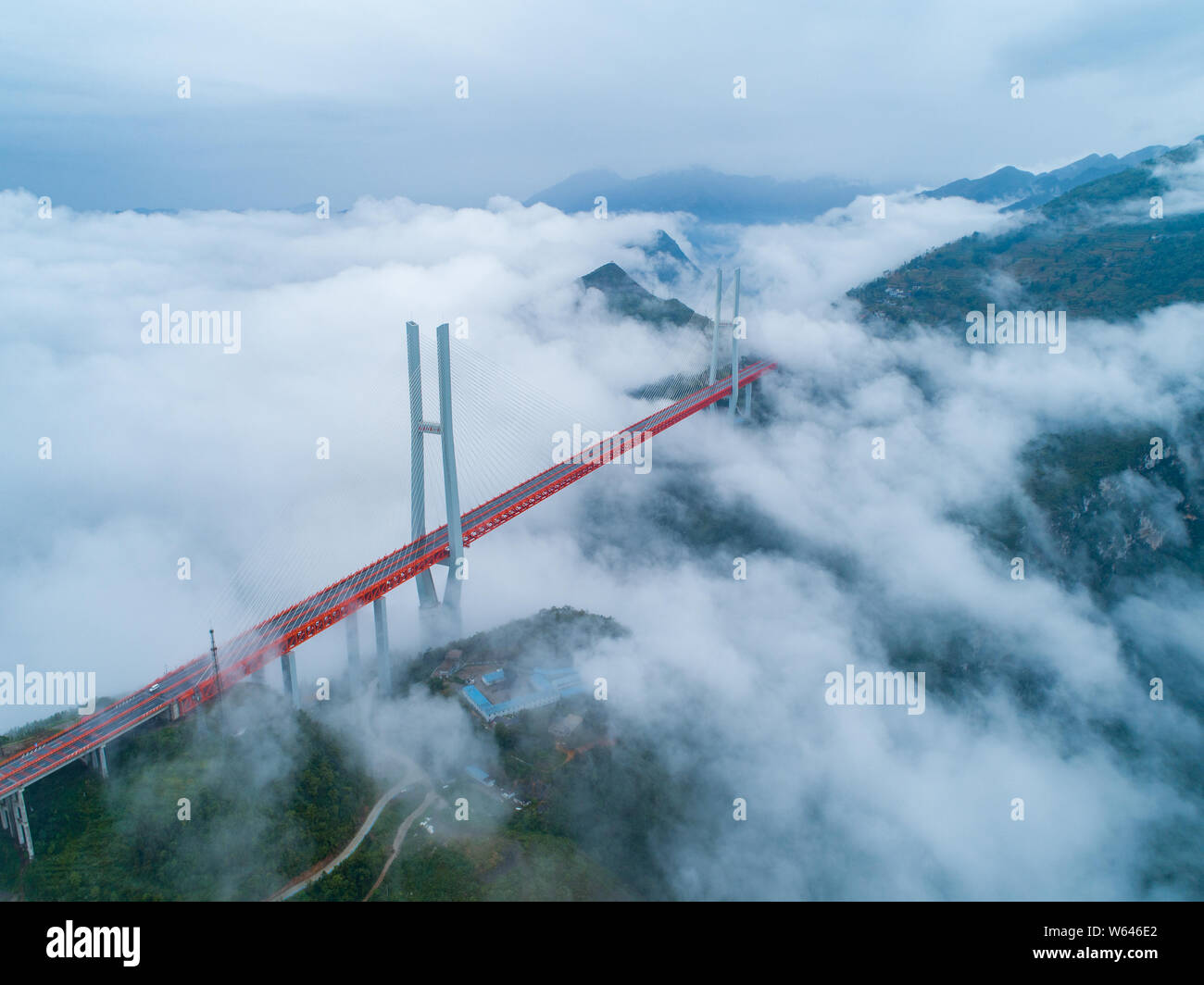 An aerial view of Beipanjiang Bridge or Beipan River Bridge in clouds ...
