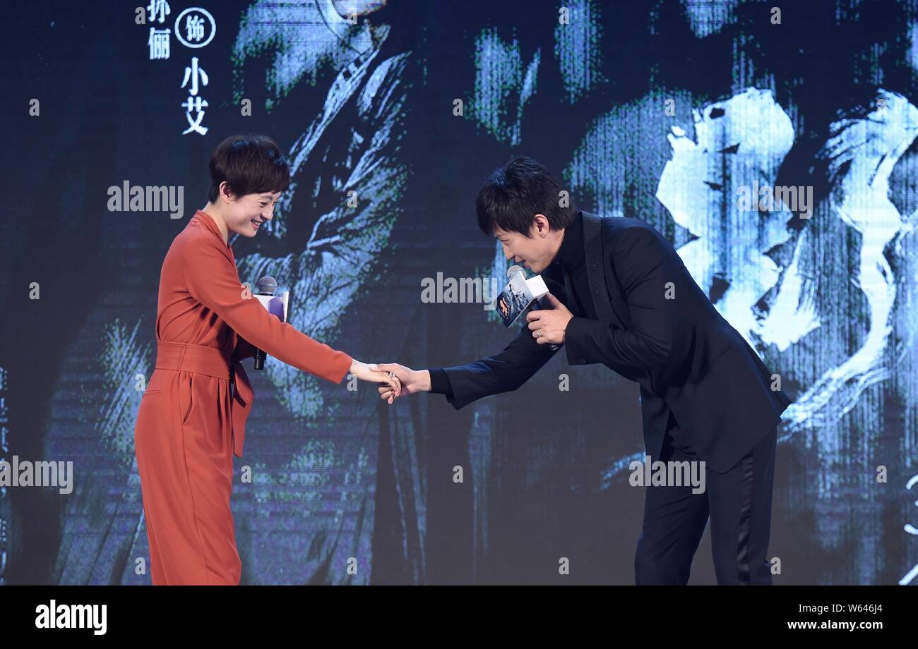 Chinese actress Sun Li, left, and her actor husband Deng Chao attend a ...
